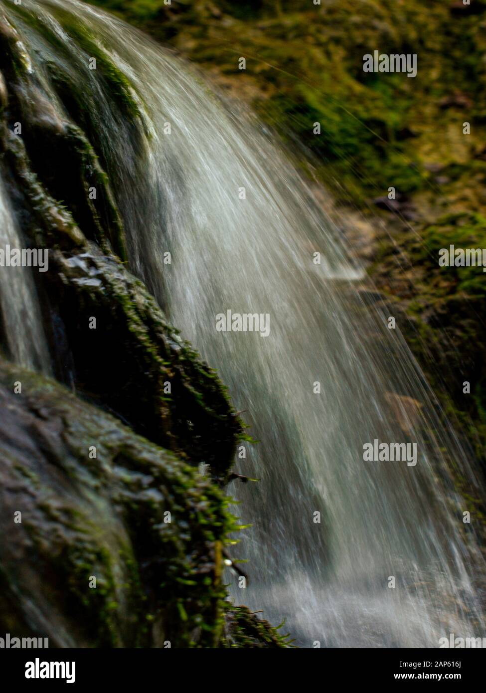 Soft waters running on rocks. Close-up of running water as a picture ...