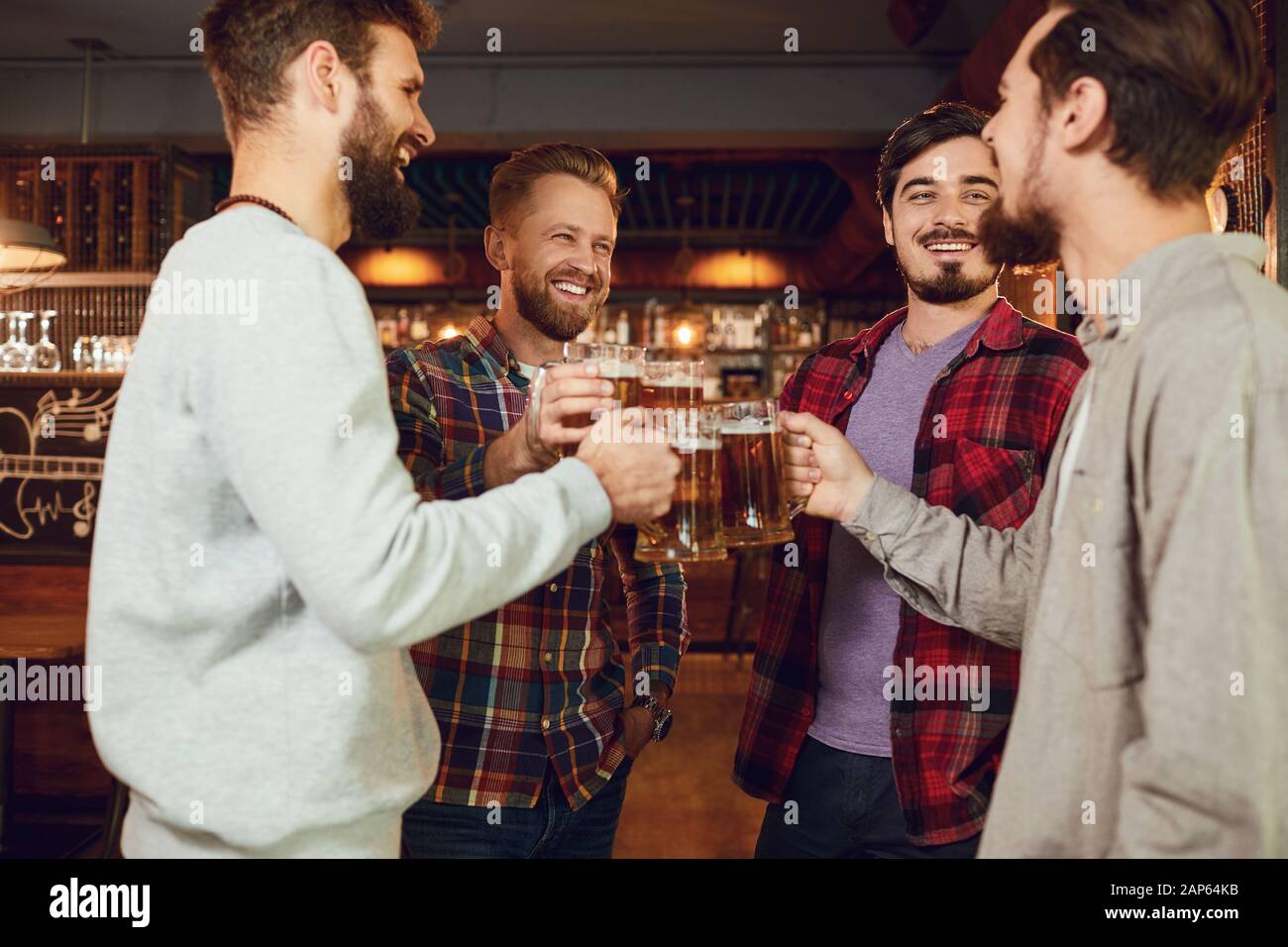 Sitting bar counter friends laughing hi-res stock photography and ...