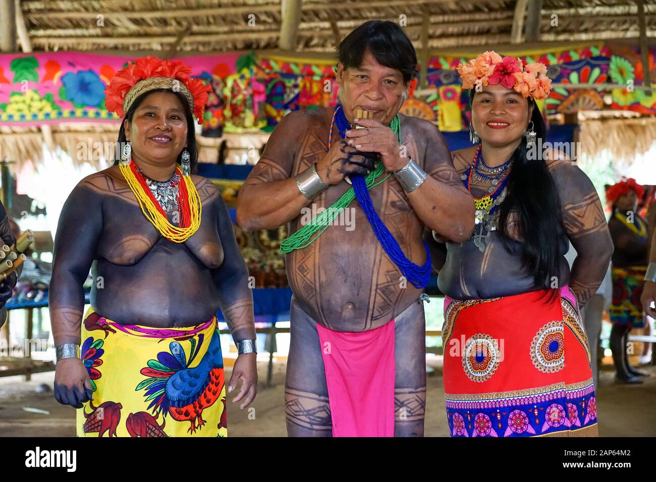 Making music with wooden flute, Embera Puru Village in Panama, indigenous community on Alajuela ...