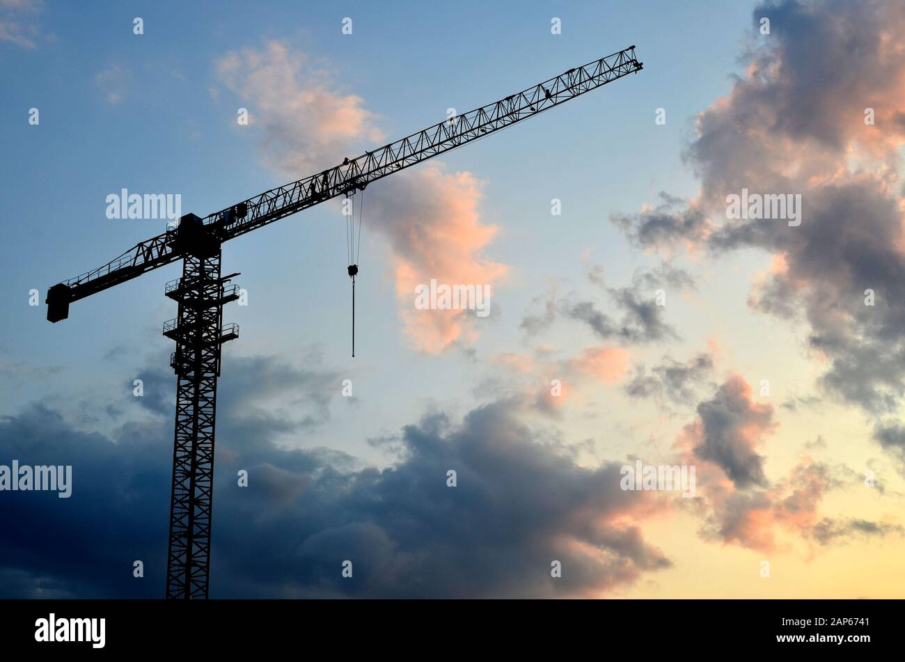 Jib construction tower crane and new residential buildings at a ...