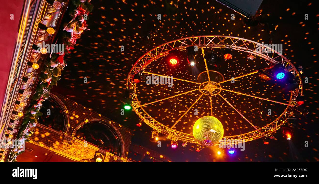 The disco ball with light rays in night club. Party background Stock ...