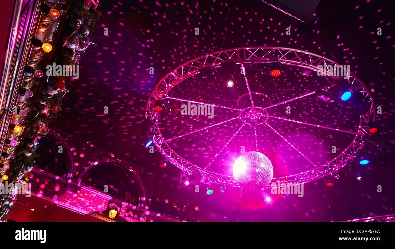 Colorful disco mirror ball lights night club background Stock Photo - Alamy