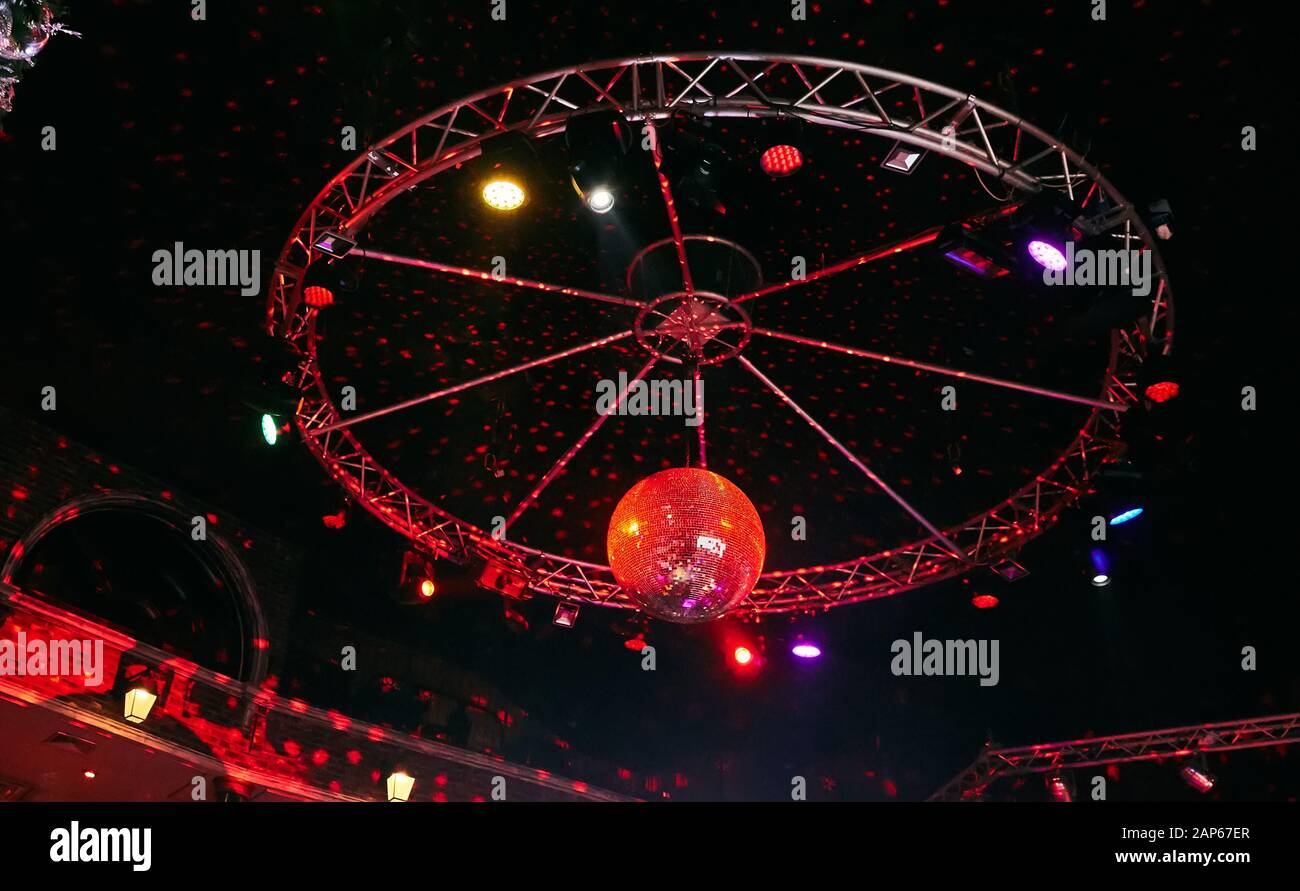 The disco ball with light rays in night club. Party background Stock ...