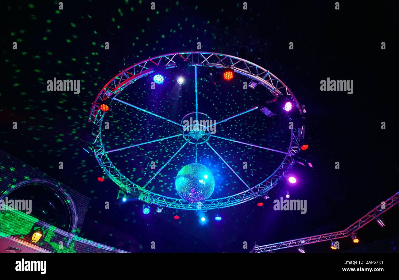 The disco ball with light rays in night club. Party background Stock ...