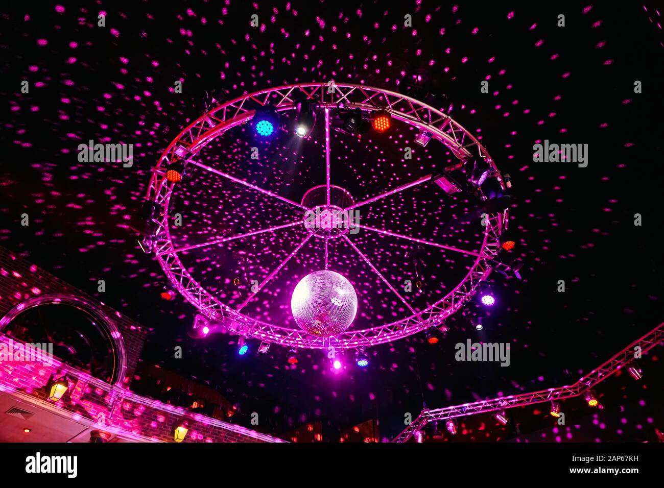 Colorful disco mirror ball lights night club background Stock Photo - Alamy