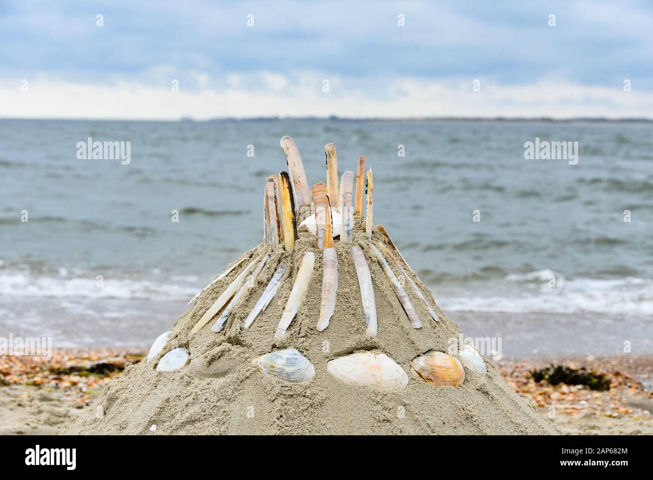 Sand castle with shells on Römö with a view of the North Sea Stock ...