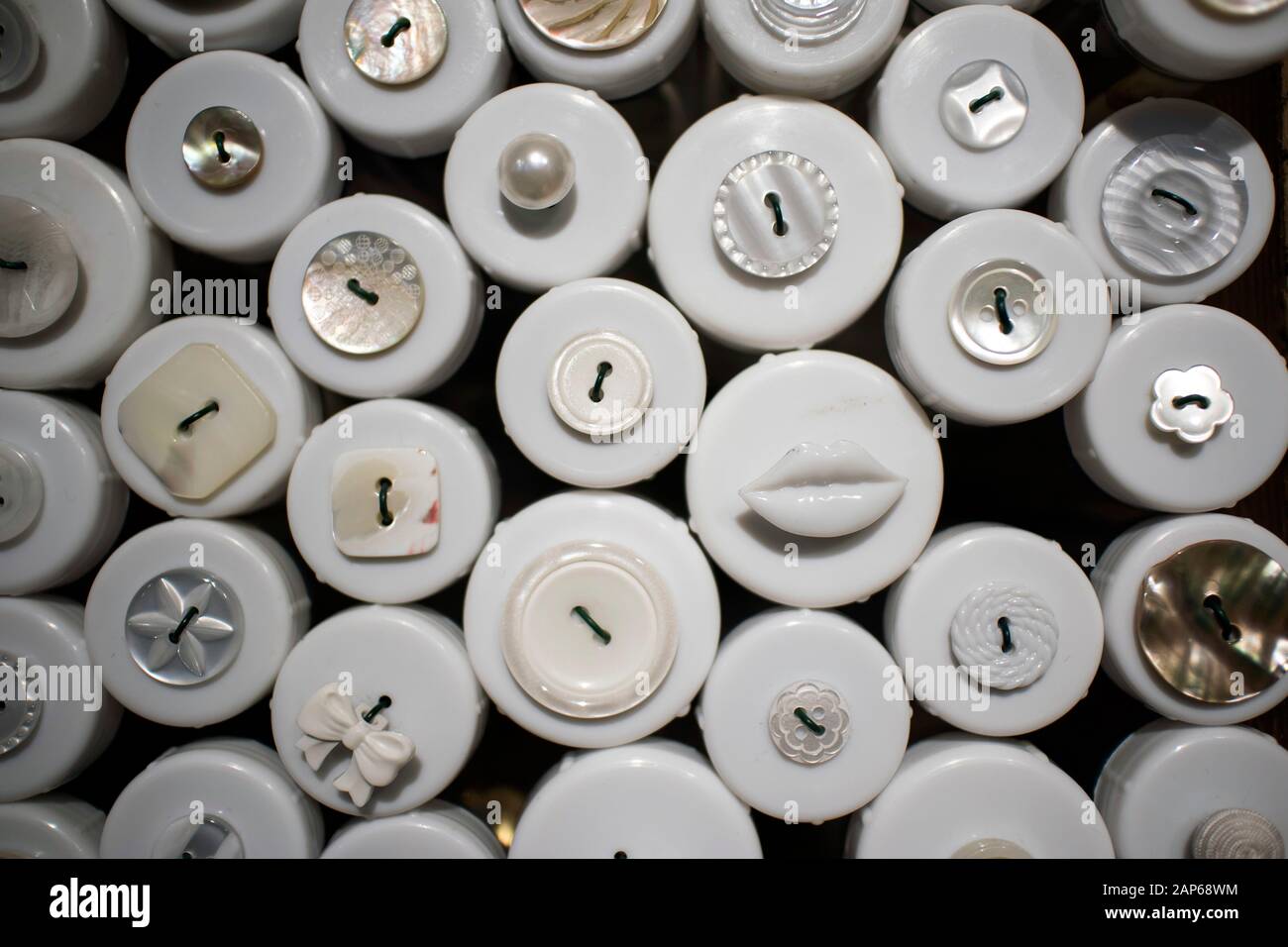 Multi-colored buttons in wooden boxes for sale in a store Stock Photo ...