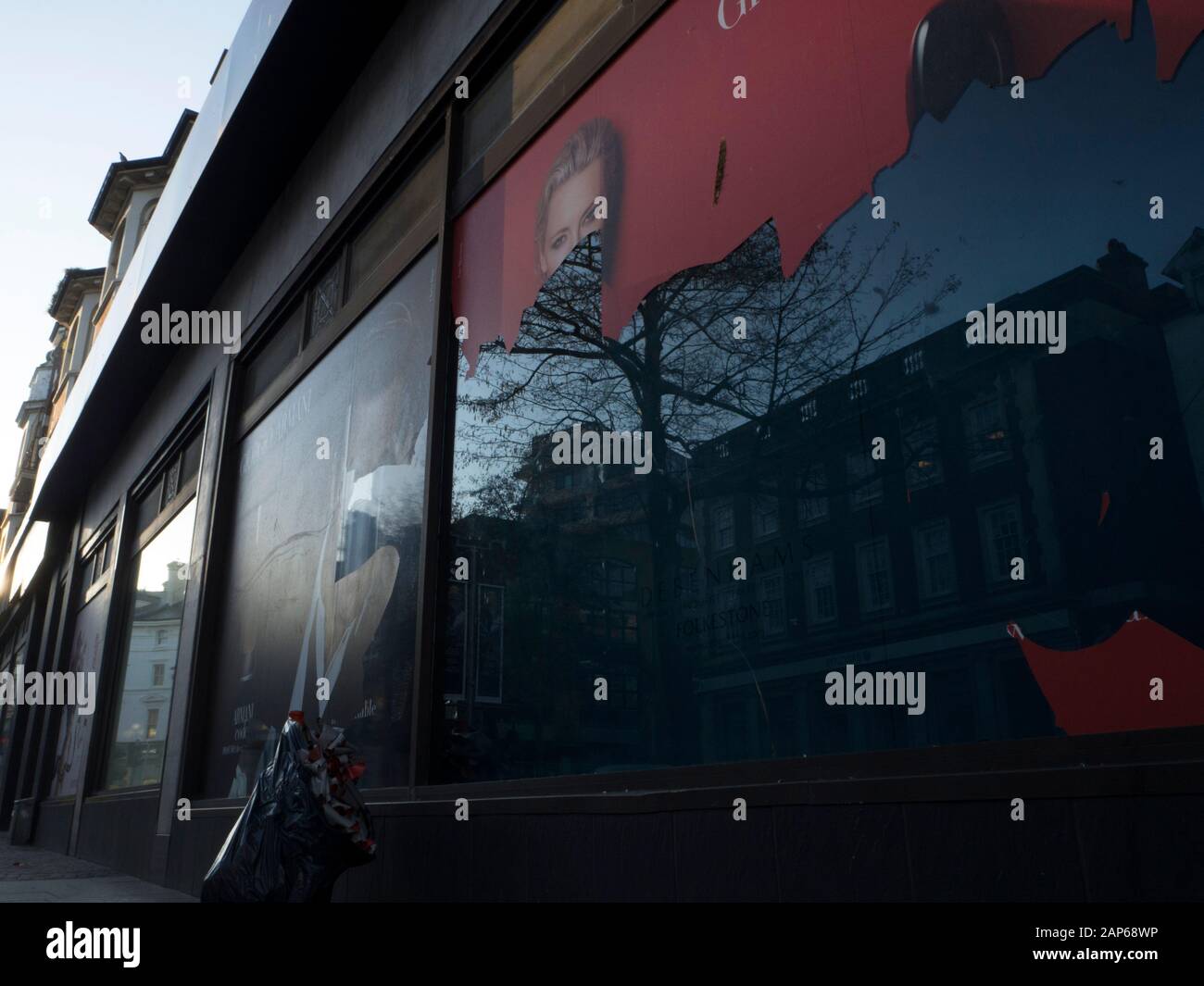 Ripped up Armani window advertisement Stock Photo - Alamy
