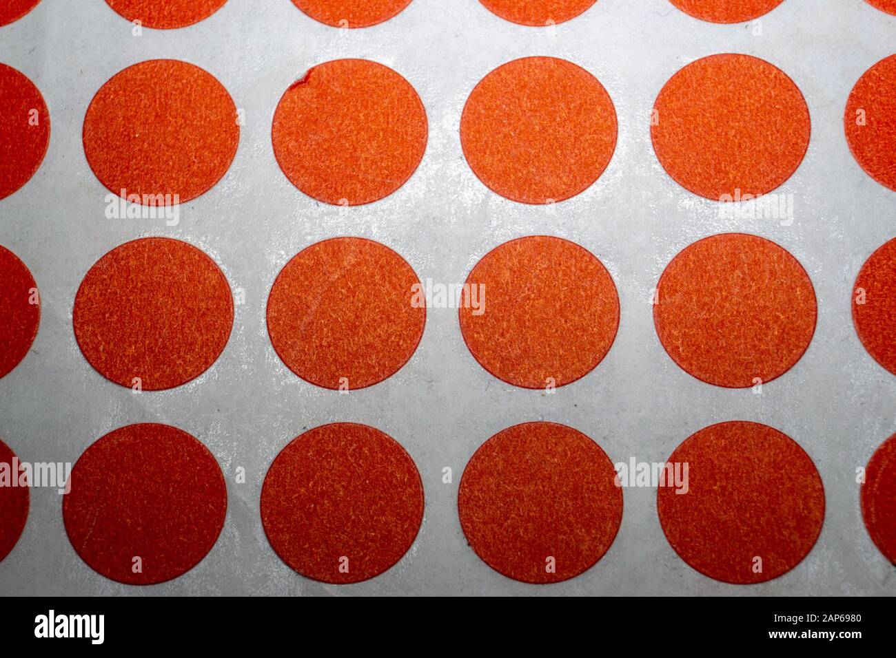 Array close-up of blank red circural multi purpose labels white ...