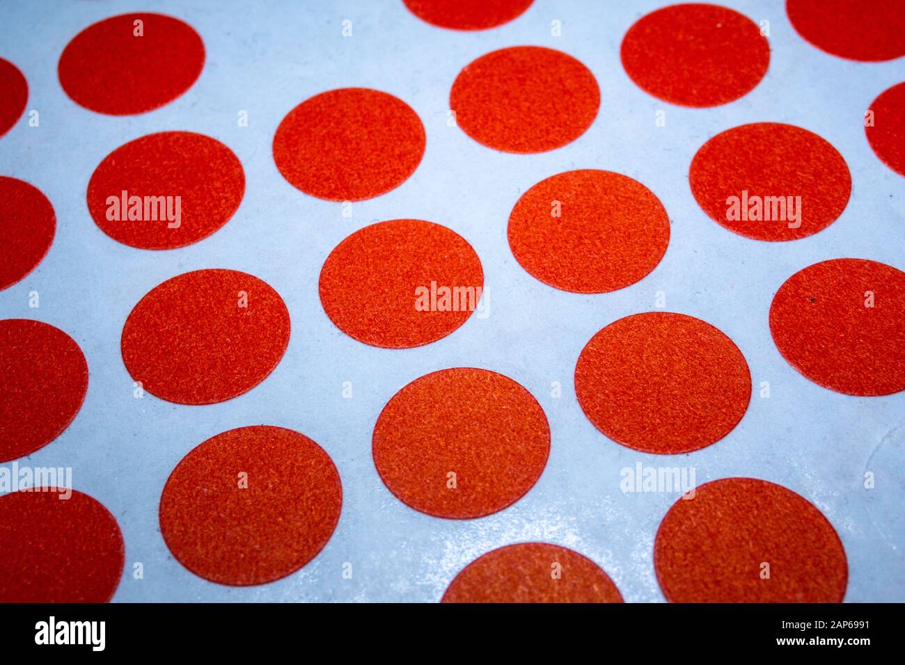 Array close-up of blank red circural multi purpose labels white ...