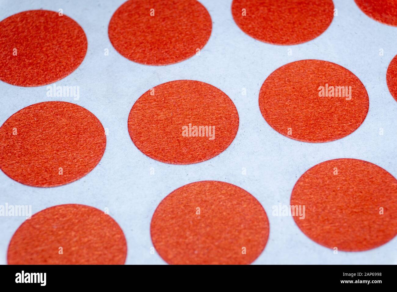 Array close-up of blank red circural multi purpose labels white ...