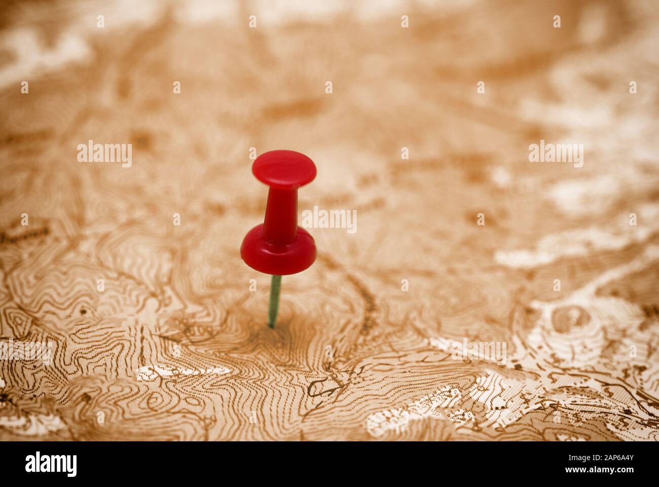 Red point on the old retro map- concept travel planning background ...