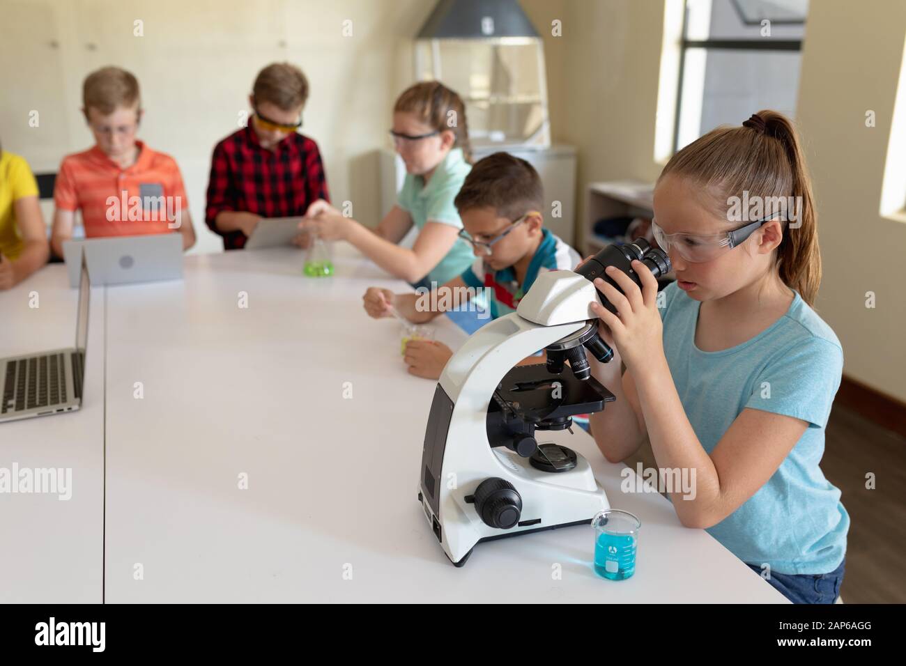 Group of elementary school kids in chemistry class Stock Photo - Alamy