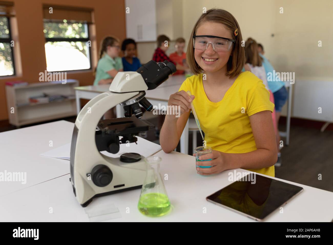 Elementary school girl in chemistry class Stock Photo - Alamy