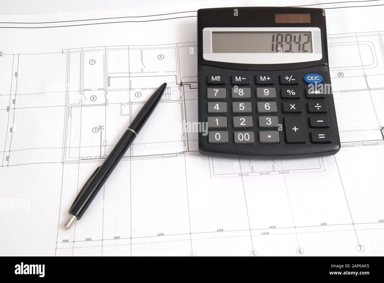 Working drawing with calculator and pen. Engineering background Stock ...