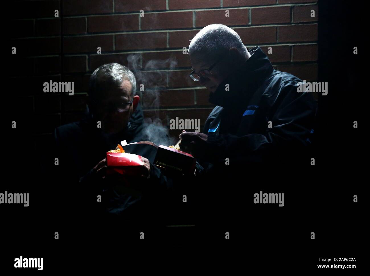 Fans enjoy pre match food before the Premier League match at the ...