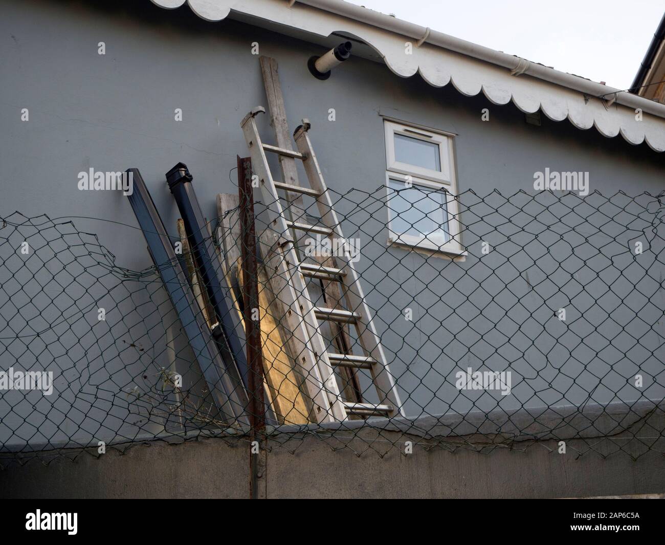 Stacked ladders hi-res stock photography and images - Alamy