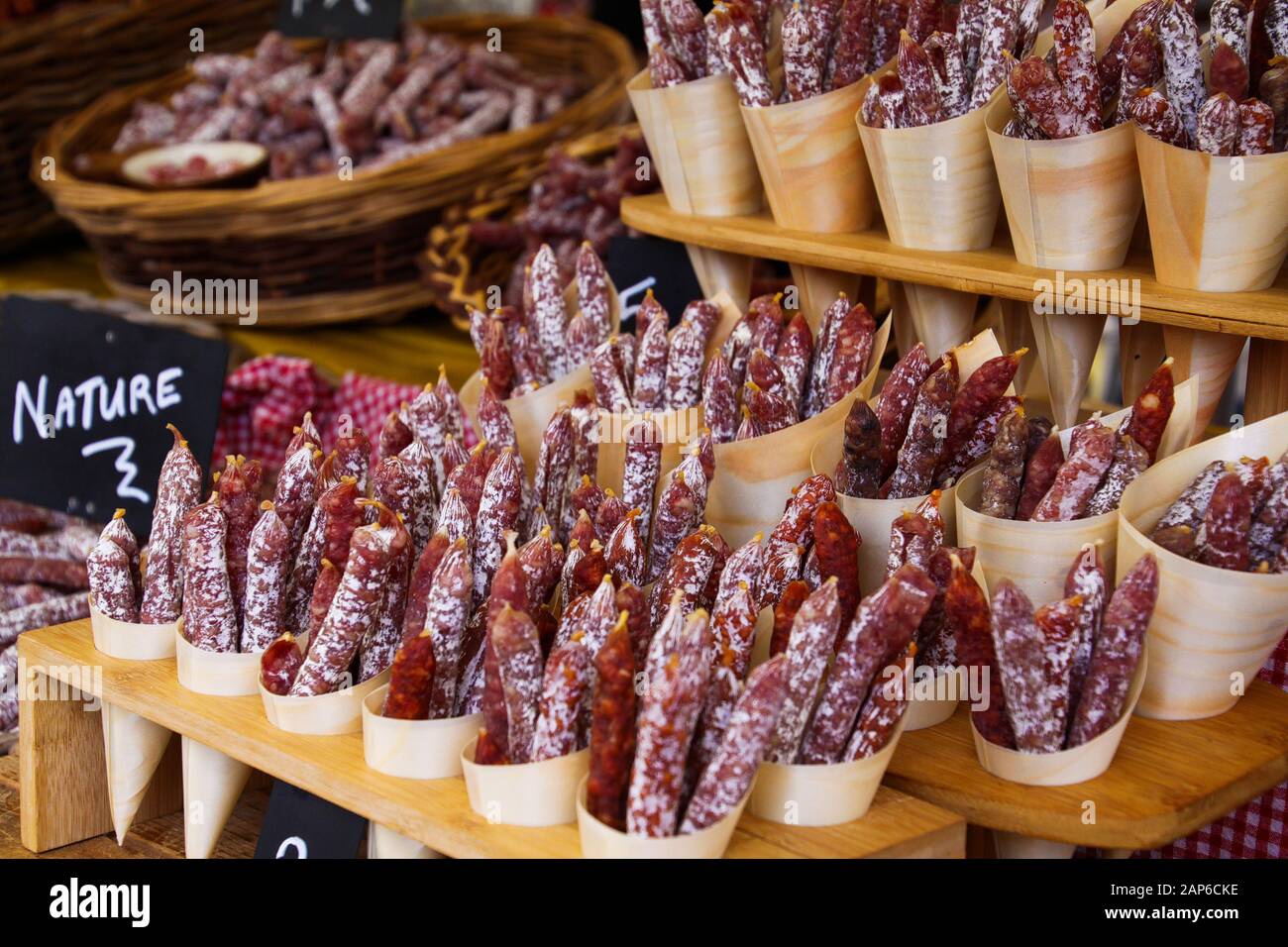 French mini salamis provencal presented in conical paper bags (cornets ...
