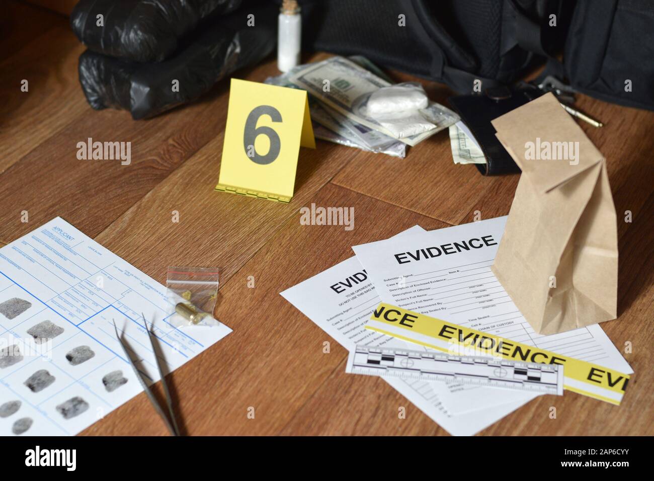 Evidence Chain of Custody Labels and brown paper bag with fingerprints ...
