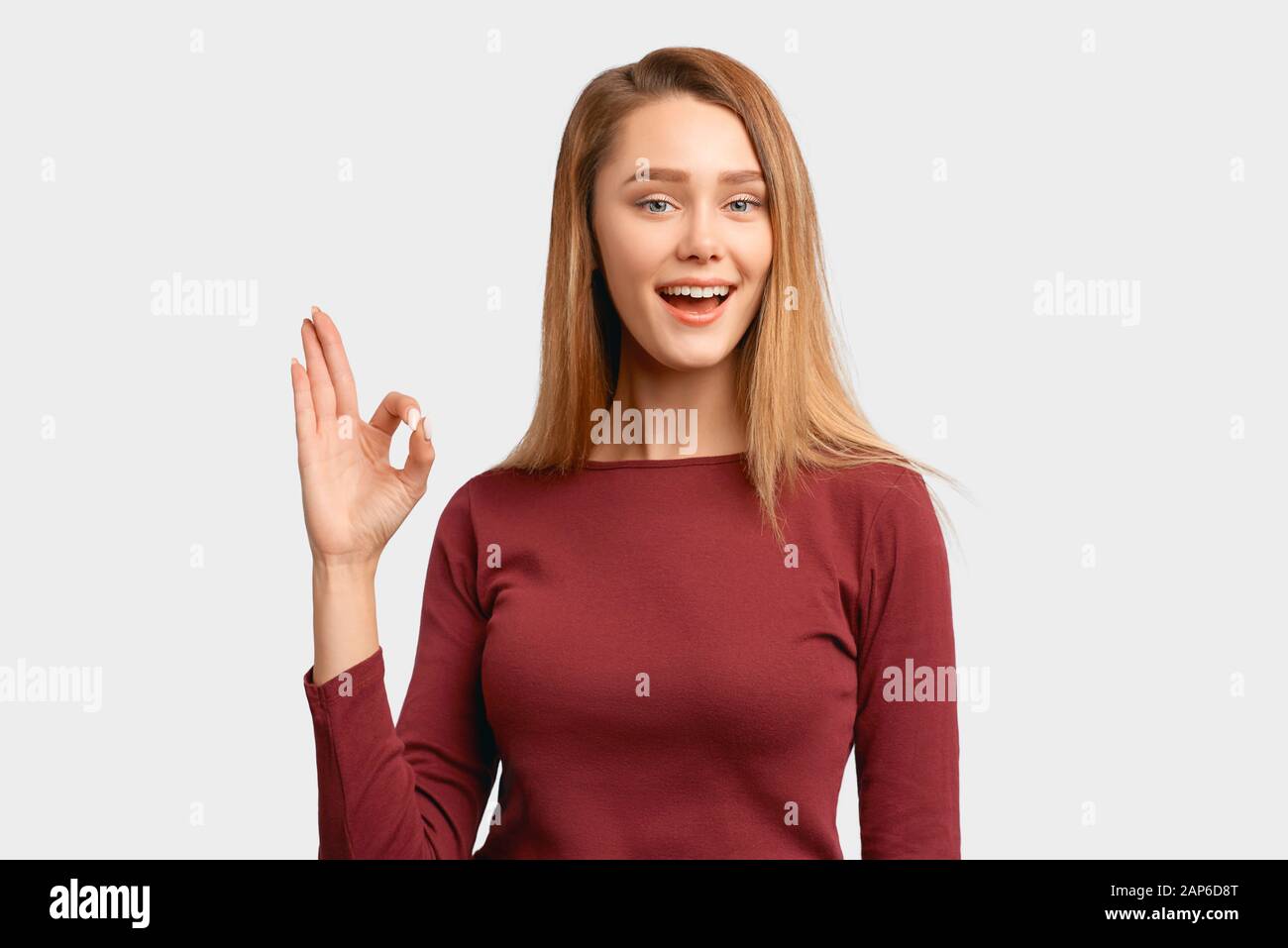 girl shows good job well done makes okay gesture Stock Photo - Alamy