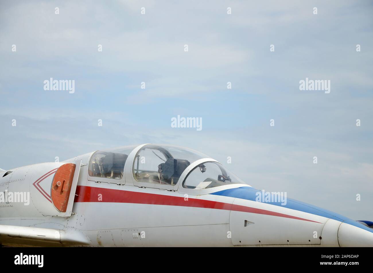 Cabin of armoured fighter aircraft close up against blue sky background ...