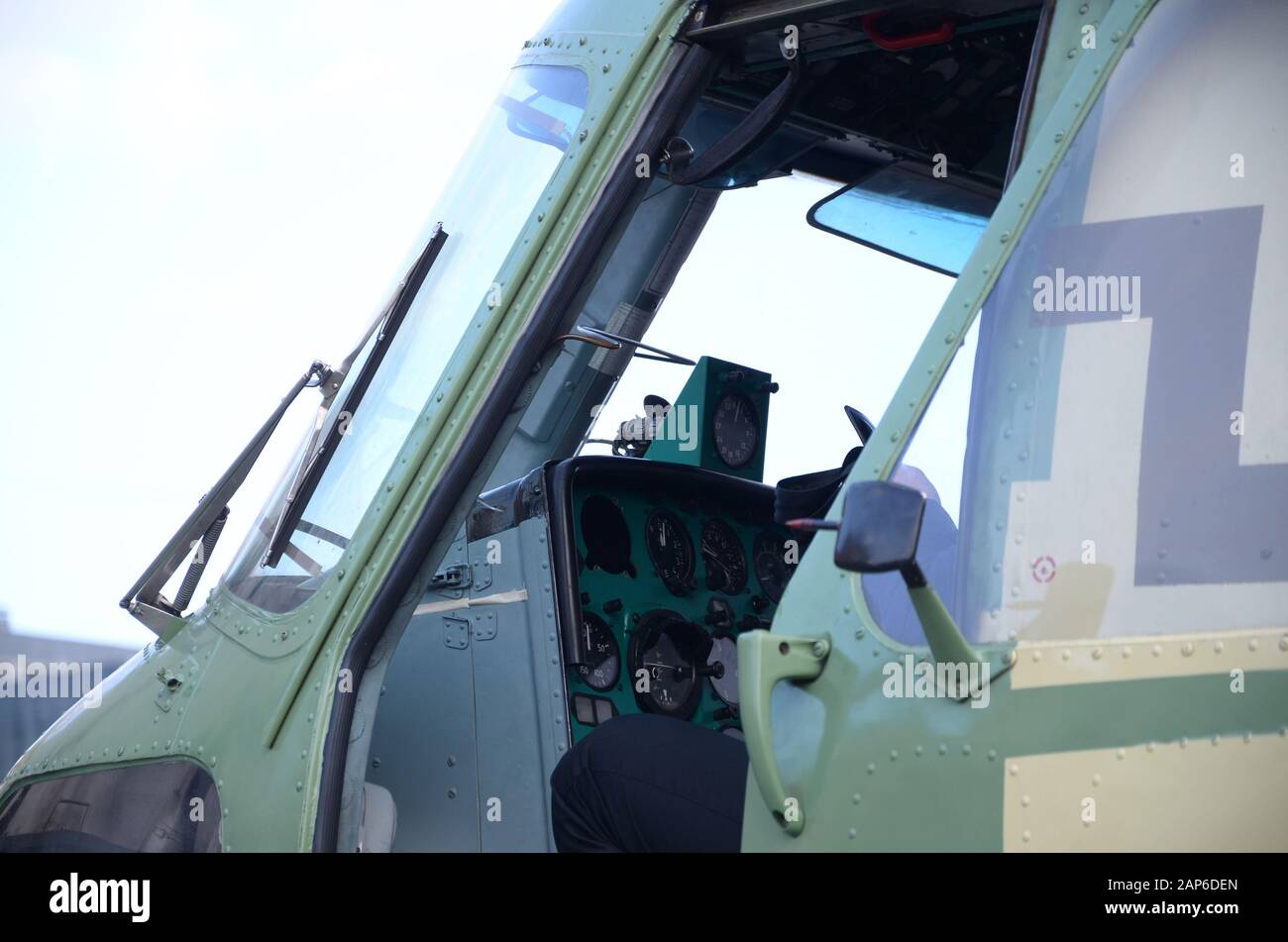 Close up view on helicopter cabin fragment. Camouflage aircraft ...