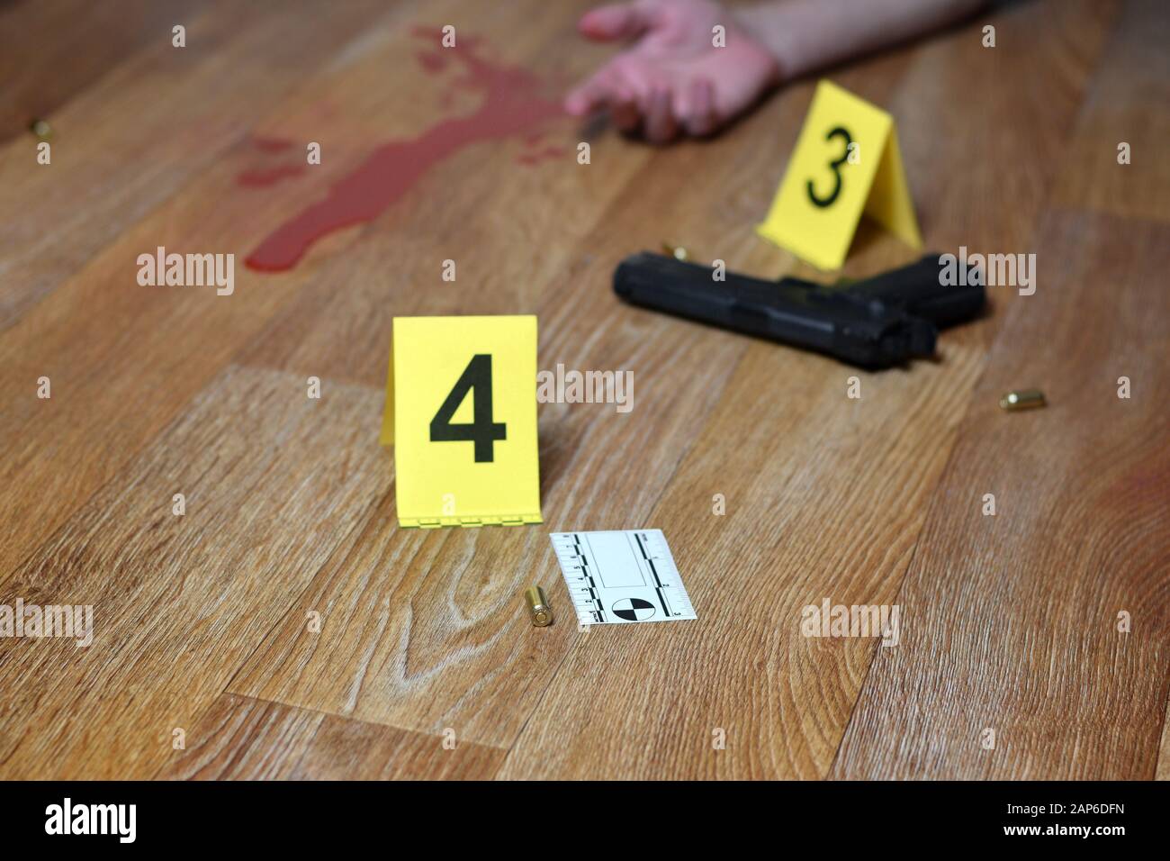 Bloody crime scene with dead body and gun on floor. Many crime scene ...