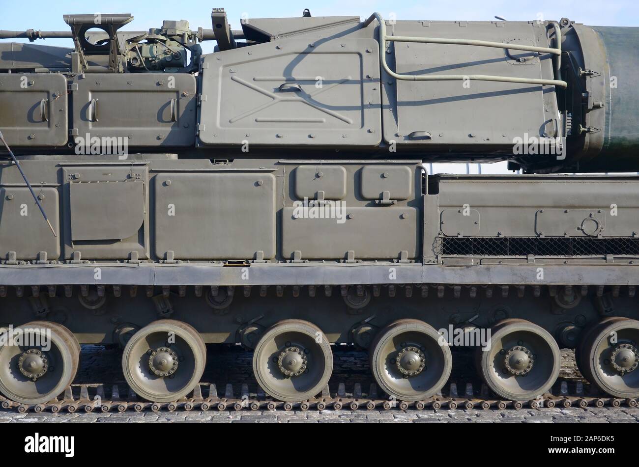 Close up view of green armoured caterpillar transport. Modern military ...