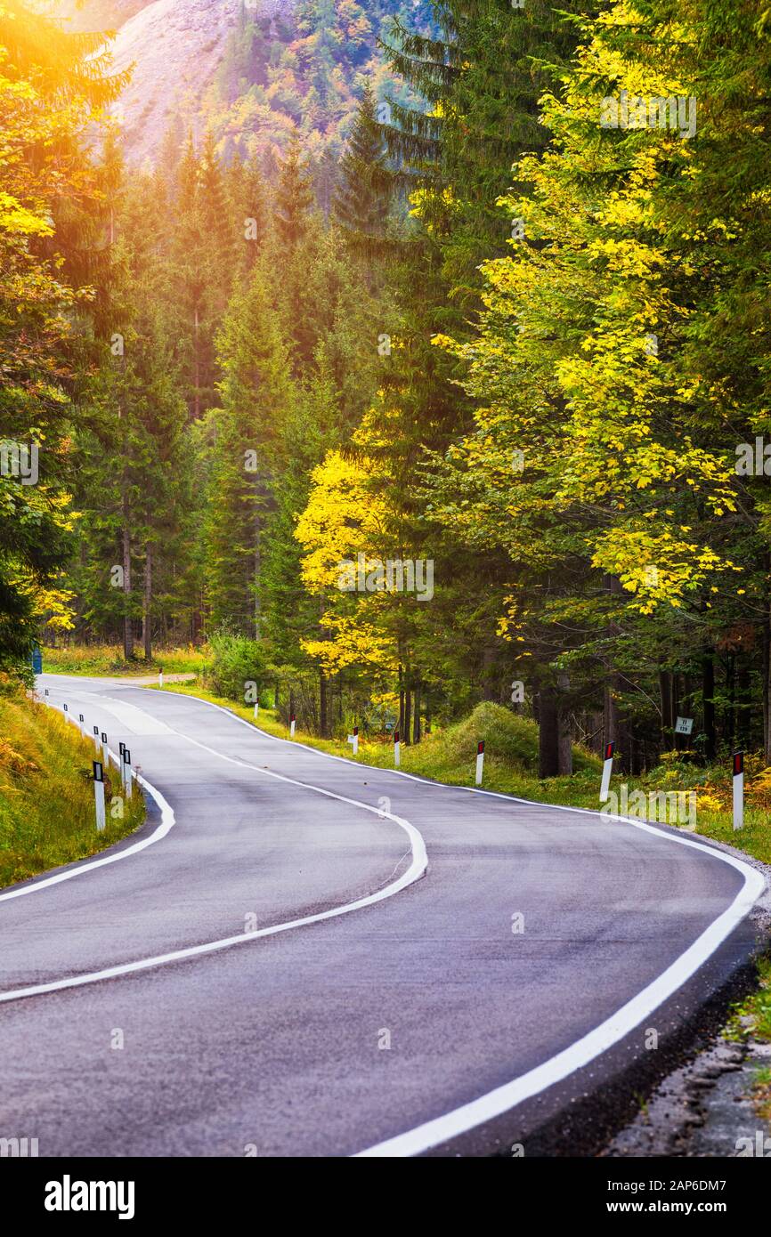 Mountain road. Landscape with rocks, sunny sky with clouds and ...