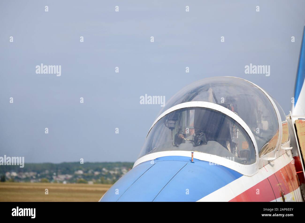 Cabin of armoured fighter aircraft close up against blue sky background ...