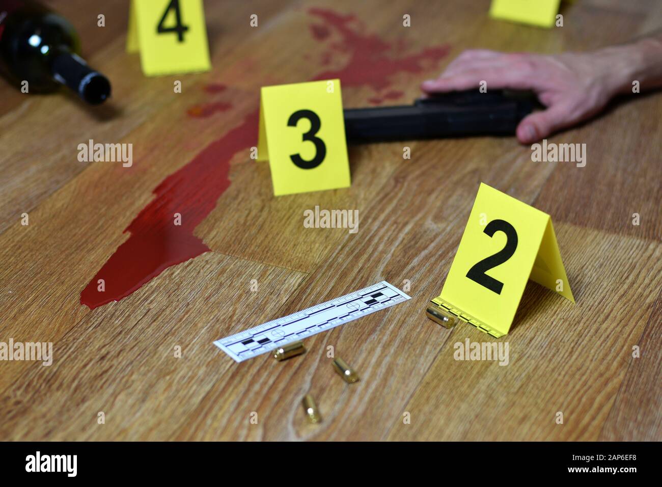 Bloody crime scene with dead body and gun on floor. Many crime scene ...