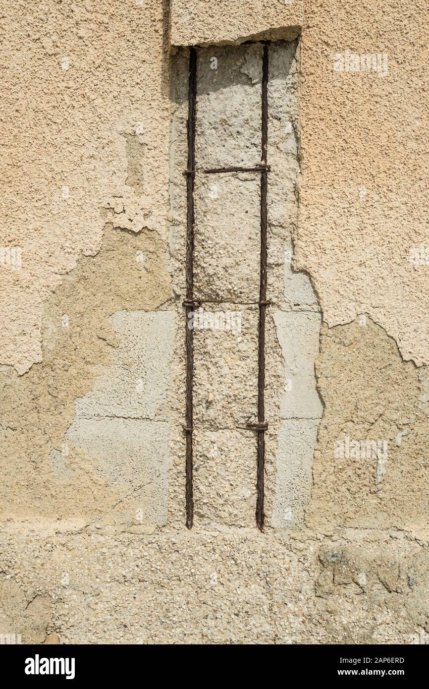 Iron work showing up underneath a weathering facade Stock Photo - Alamy