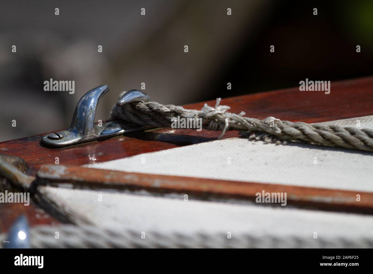 Metal Fairlead close-up on a vintage wooden Sailboat Stock Photo - Alamy