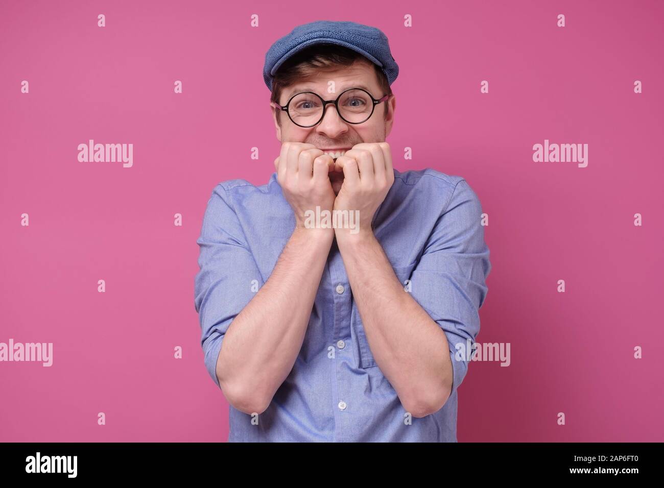 Worried senior man biting hi-res stock photography and images - Alamy