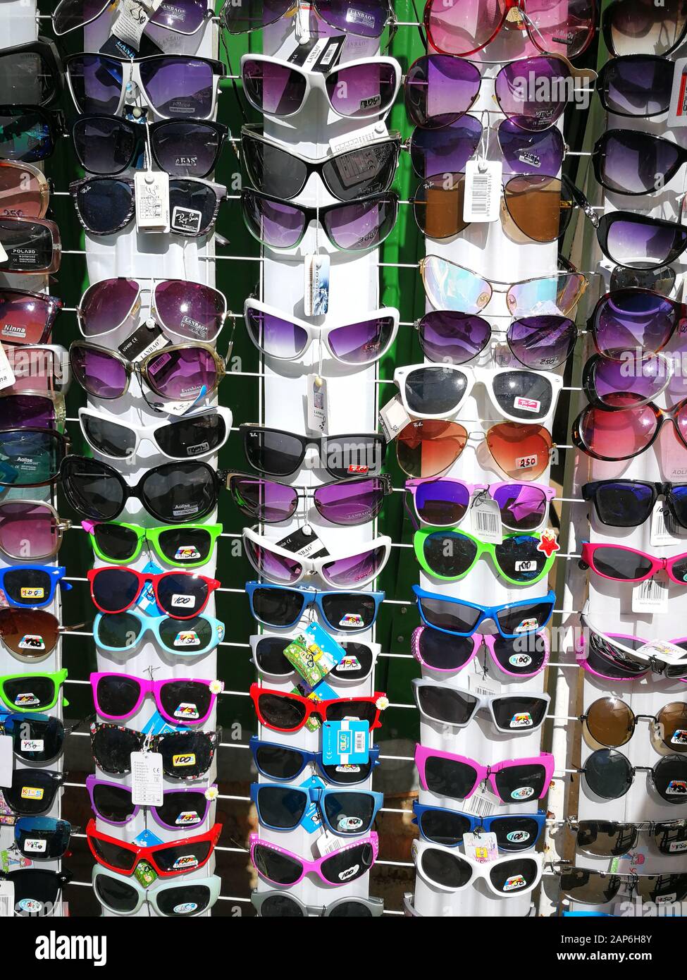 Sunglasses are hanging on a shop window Stock Photo - Alamy