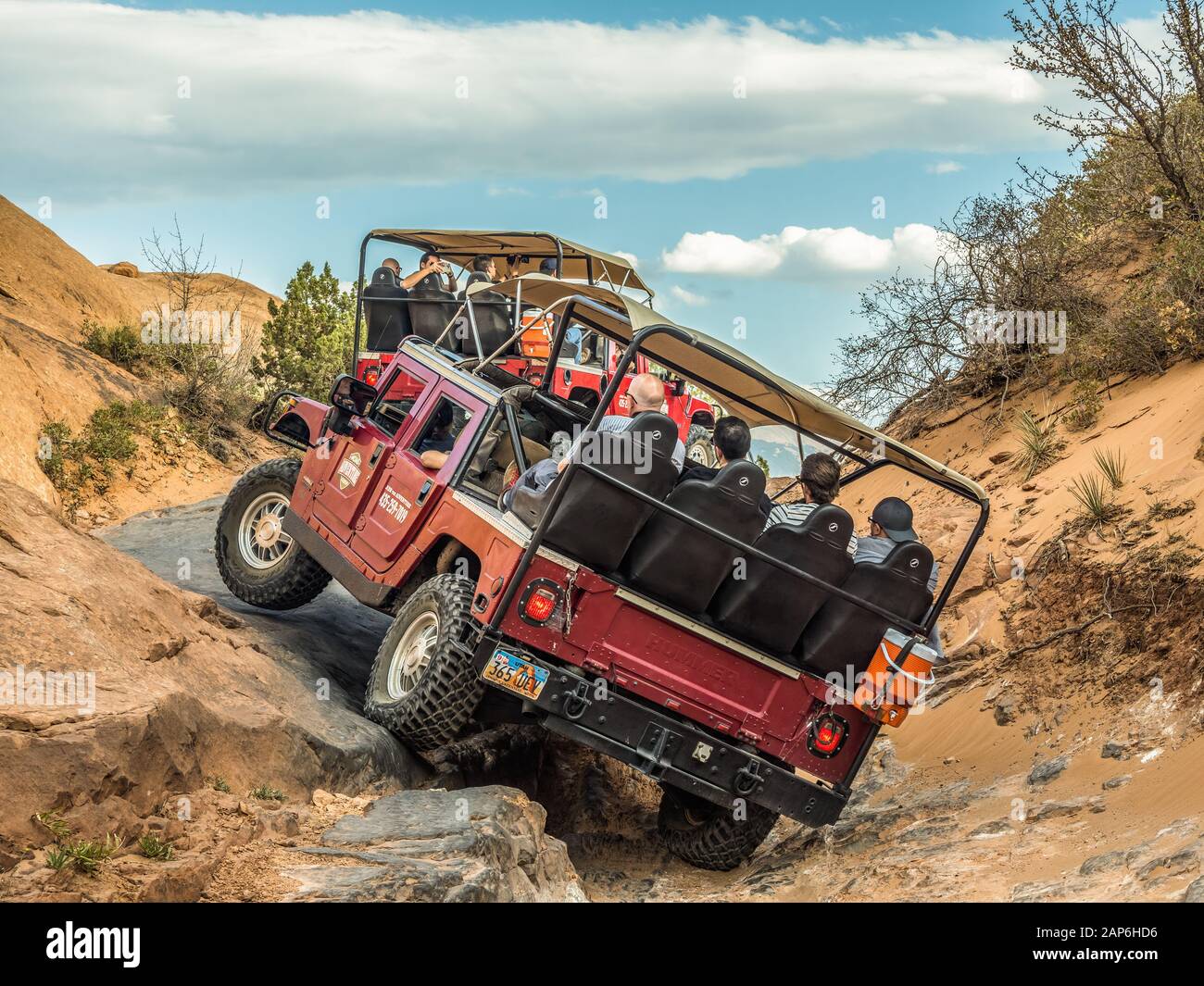 A Hummer lifts a tire climbing during a 4x4 Hummer tour on the Hell's ...