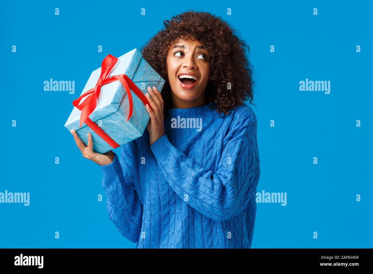 Expectations, holidays and winter concept. Excited cheerful african ...