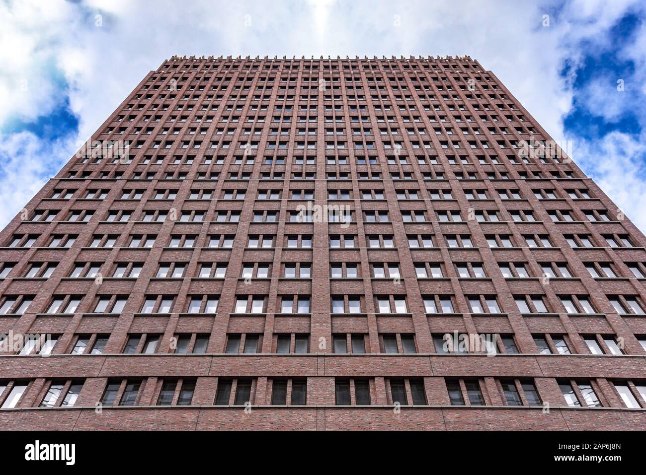 A tall building against an overcast sky Stock Photo - Alamy
