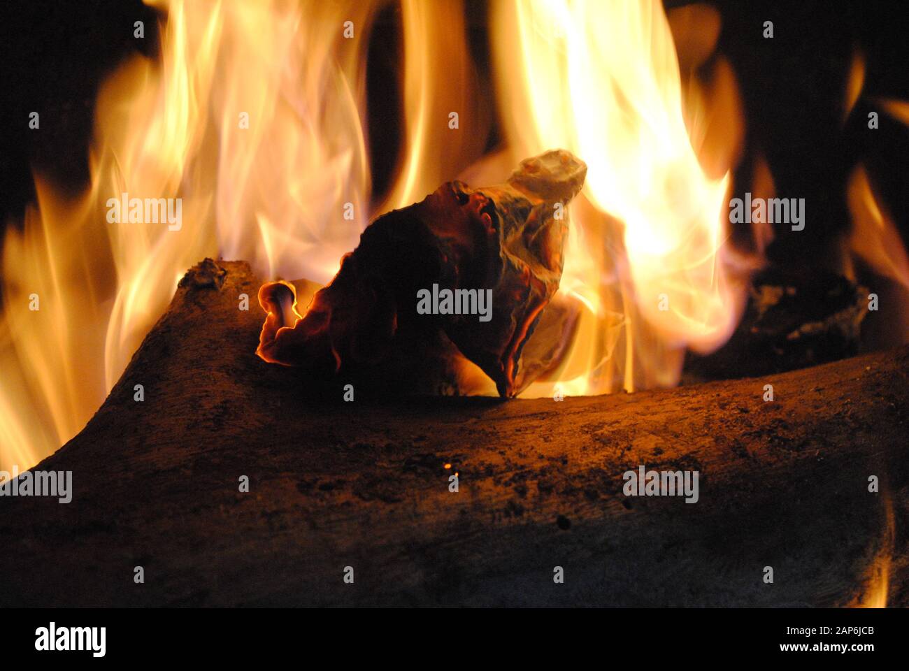 A piece of paper catching fire Stock Photo - Alamy