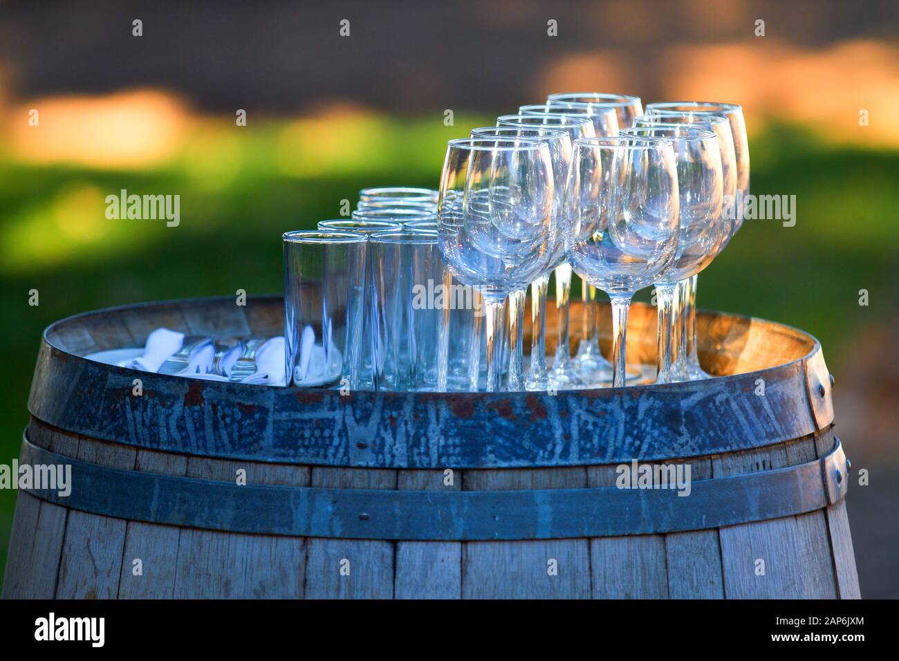 Wooden Barrel With Wine Glasses at Sunset Stock Photo - Alamy