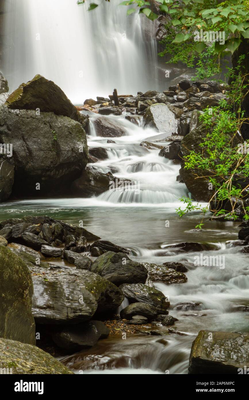 Waterfall with stream and rocks in rainforest Stock Photo - Alamy