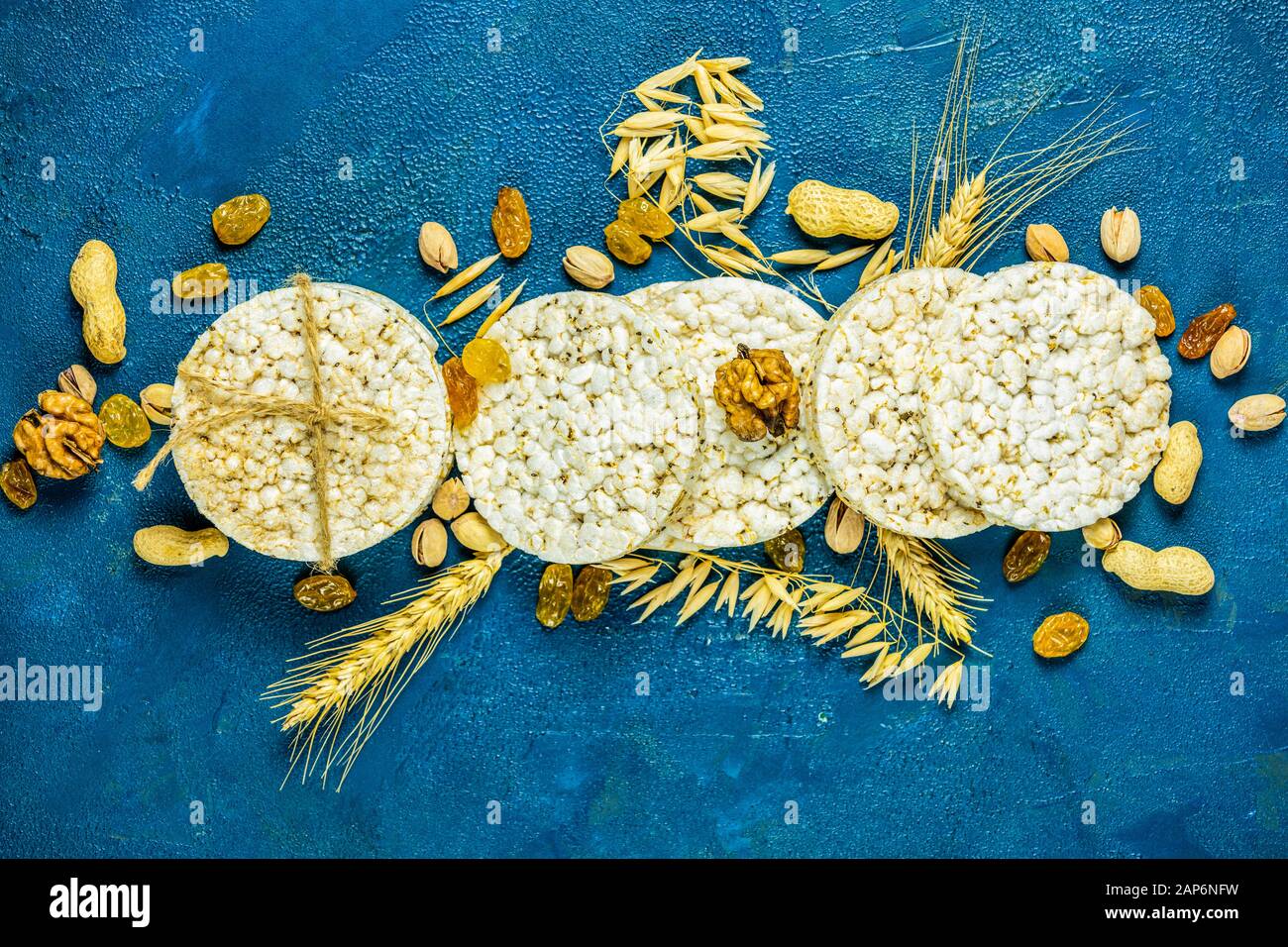American puffed rice cakes. Healthy snacks with ears of wheat on ...