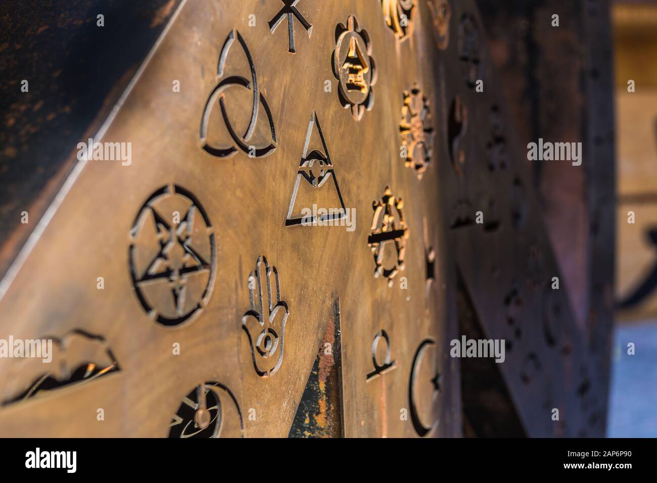 Cut out symbols on a copper steel structure Stock Photo - Alamy