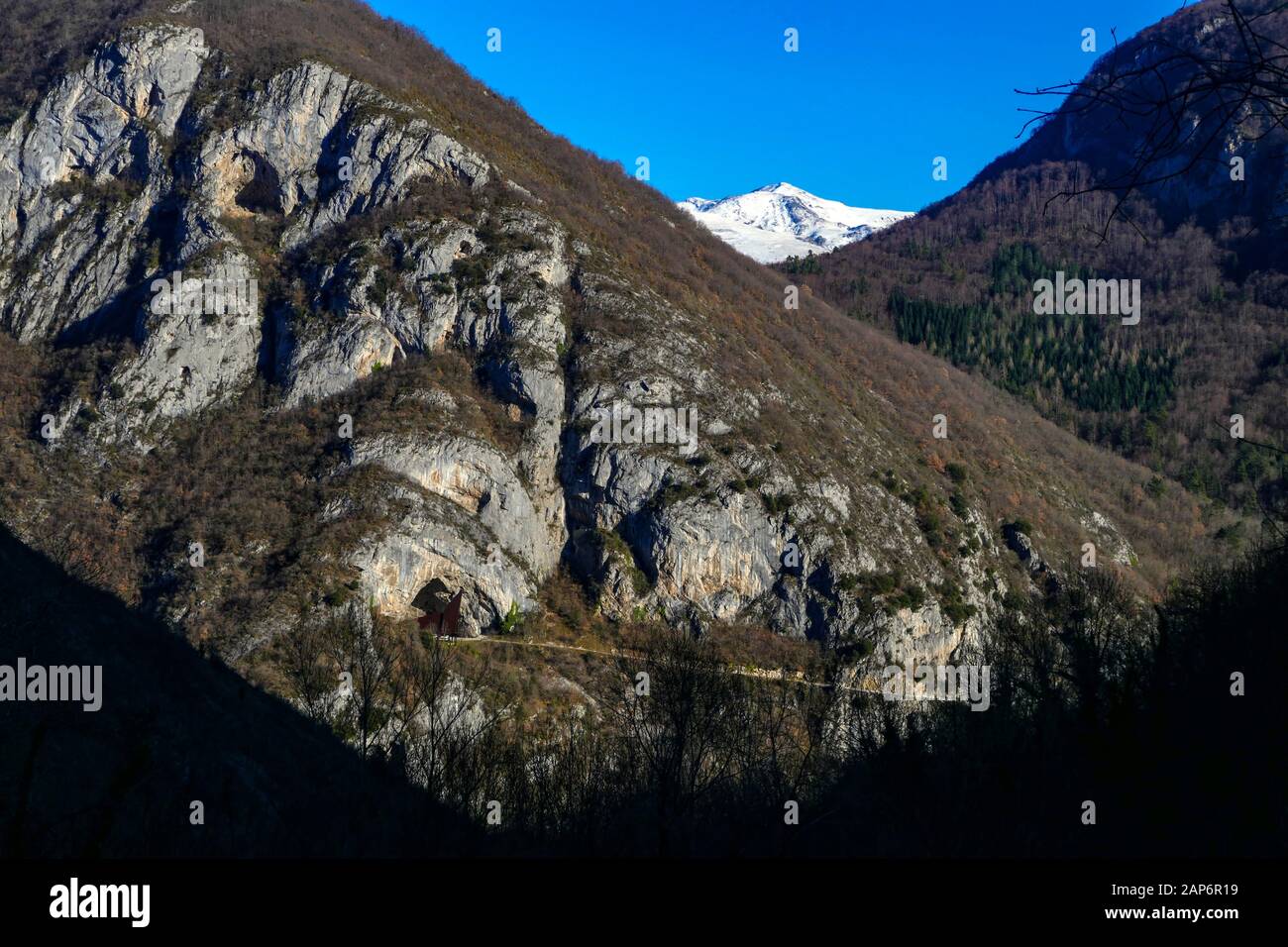 Niaux Cave and access road with snowy Mont Olmes behind, seen from ...