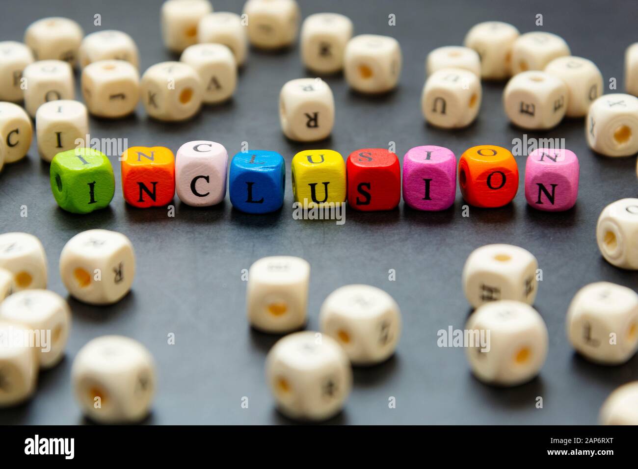 Inclusion text of multi colored cubes on dark background. Inclusive ...