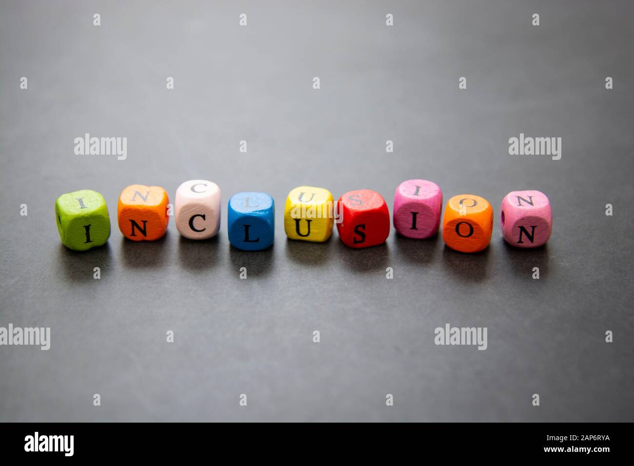 Inclusion text of multi colored cubes on dark background. Inclusive ...