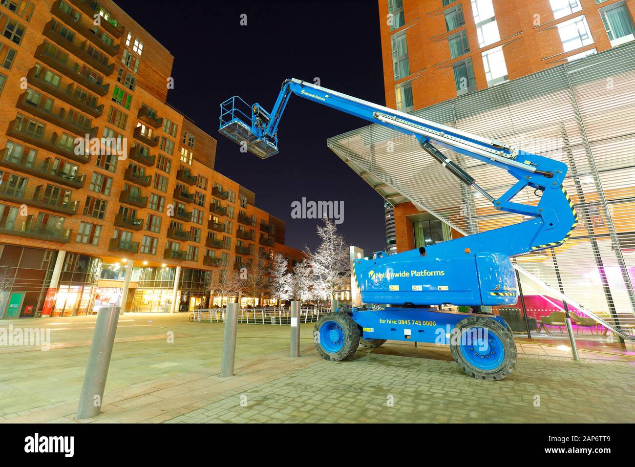 A boom lift (cherrypicker) parked in Granary Wharf in Leeds used for ...