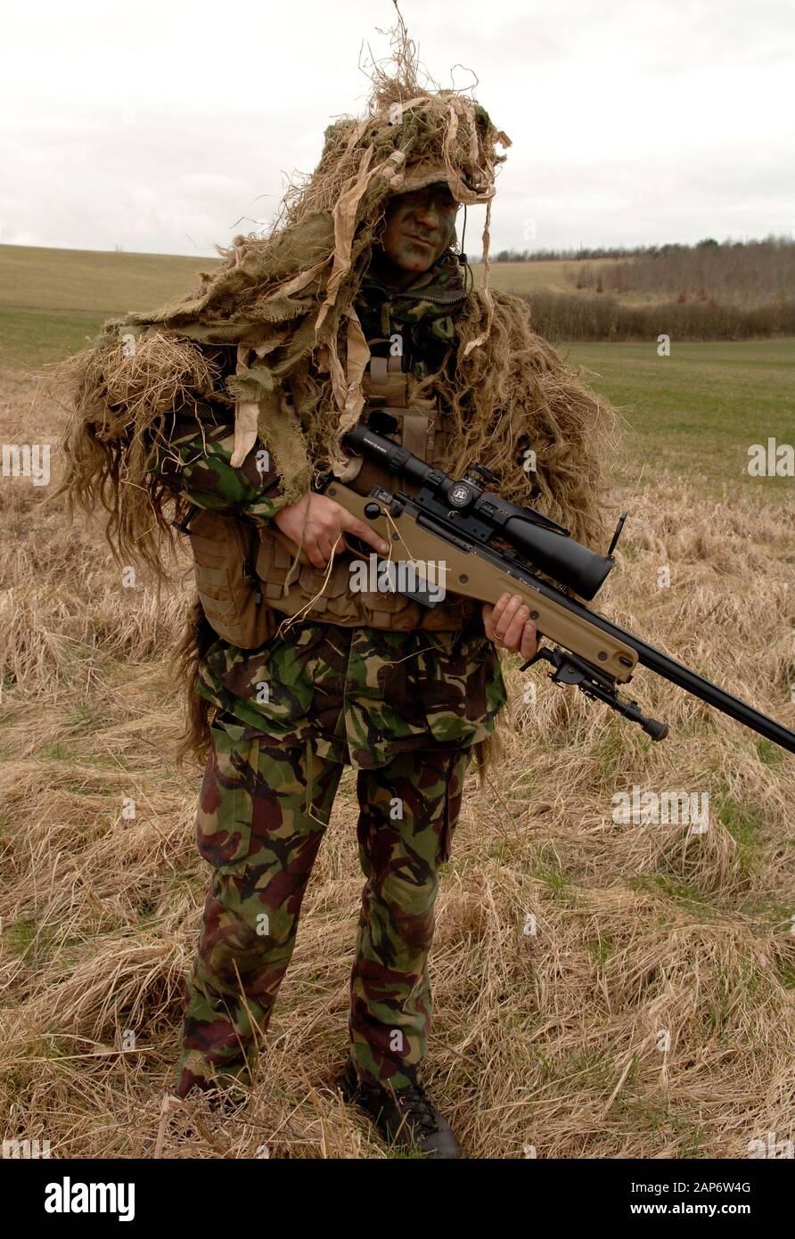 British Infantryman with a long range sniper rifle L115A3 which has a ...