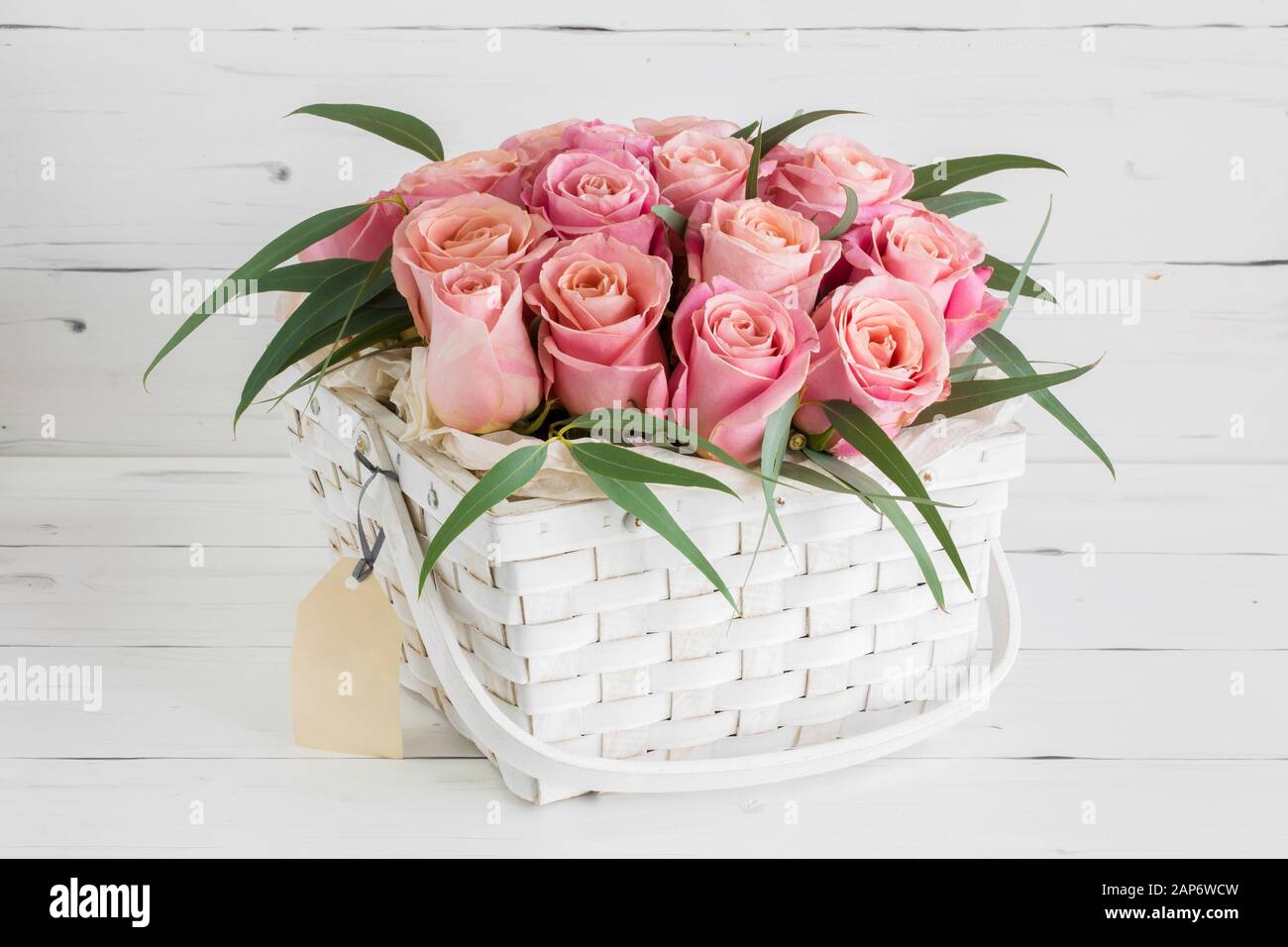 White basket with roses Stock Photo - Alamy