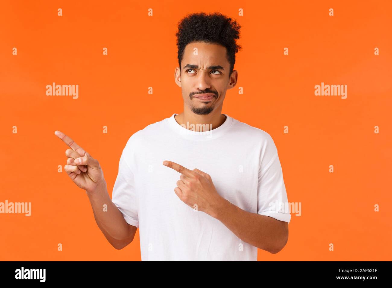 Skeptical and reluctant disappointed african-american man, afro haircut ...
